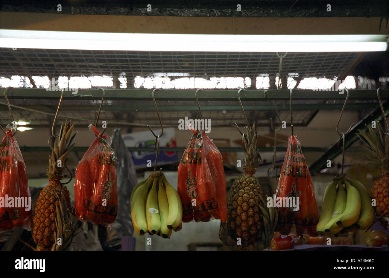 Fruit hang from hooks Stock Photo - Alamy