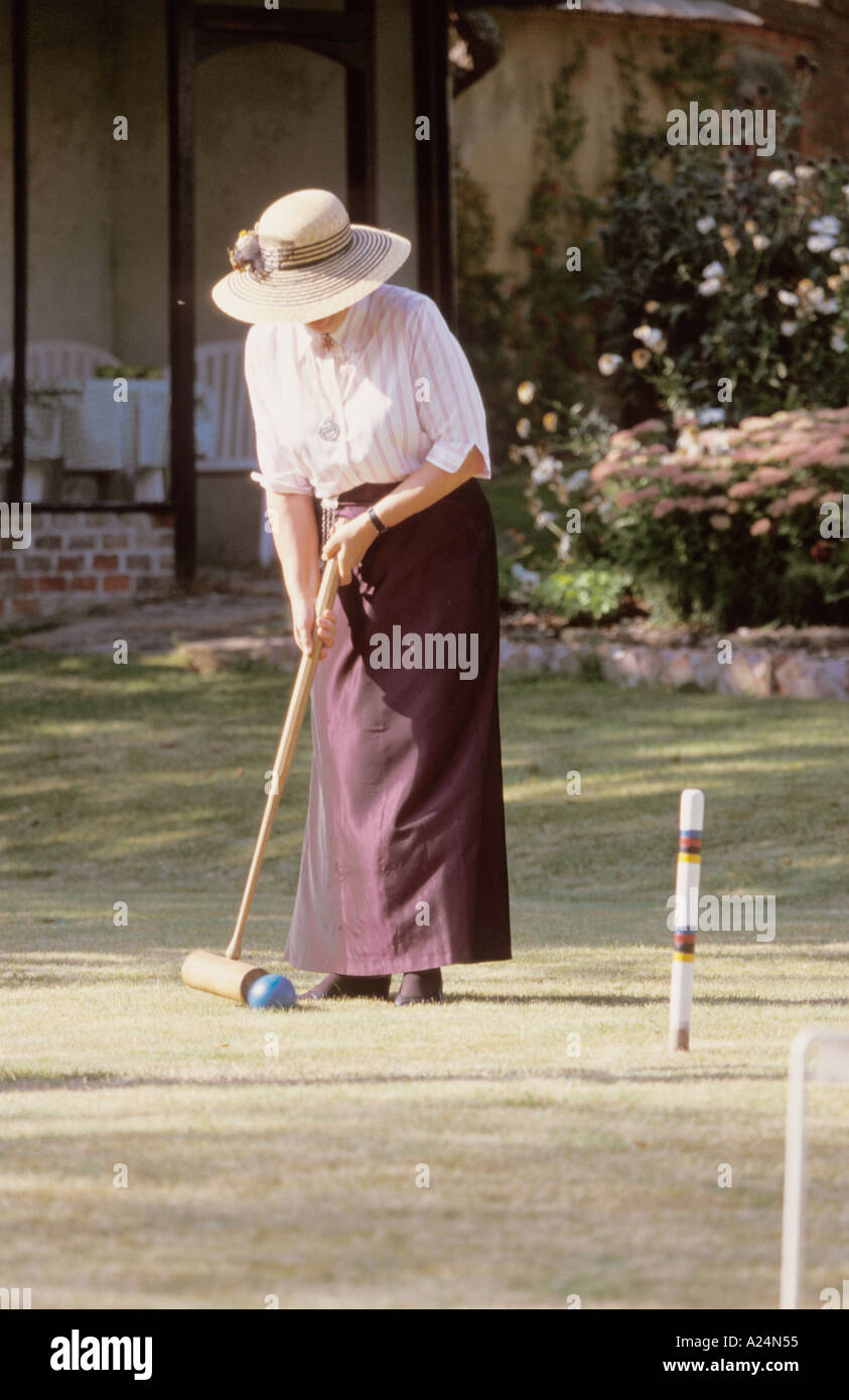 Croquet game players in Victorian Dress Lawn Grass Hoop Ball Mallet Man ...