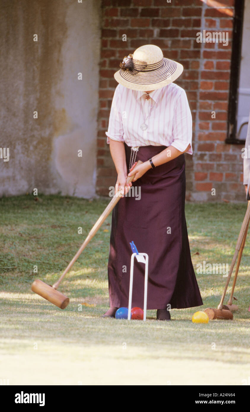 Croquet game players in Victorian Dress Lawn Grass Hoop Ball Mallet Man ...