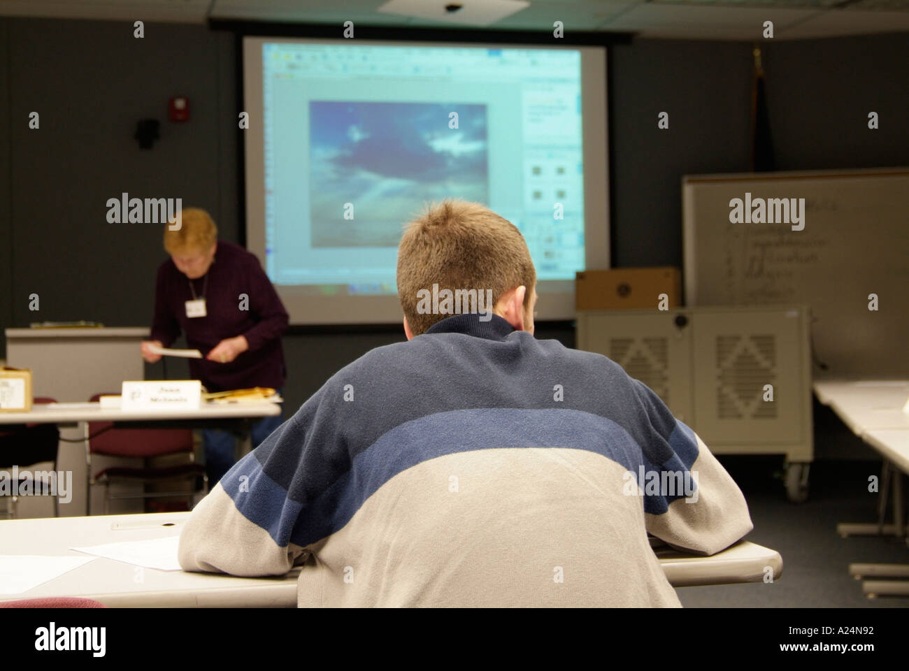 Adult computer class training is conducted during a business meeting ...