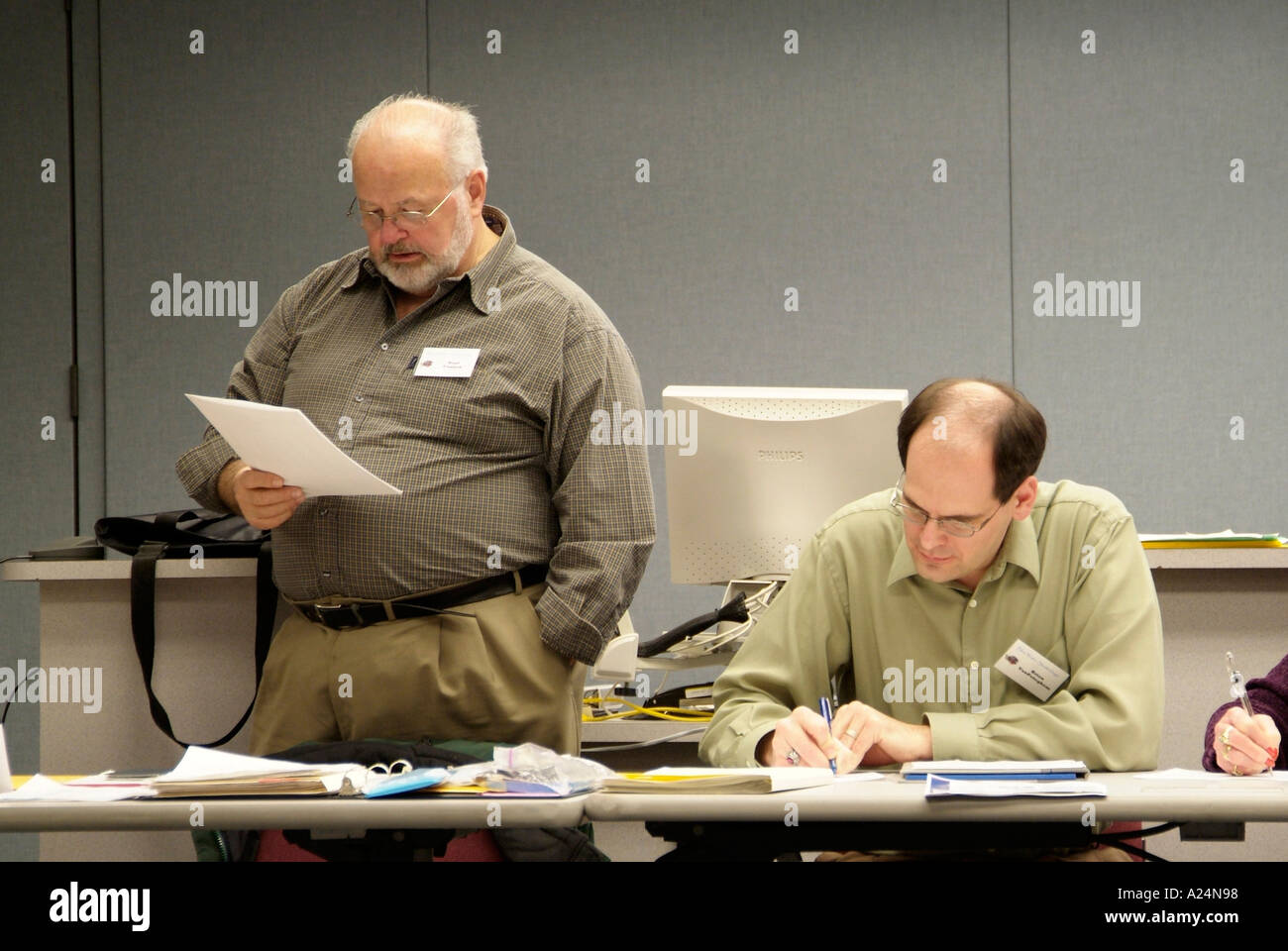 Adult computer class training is conducted during a business meeting ...
