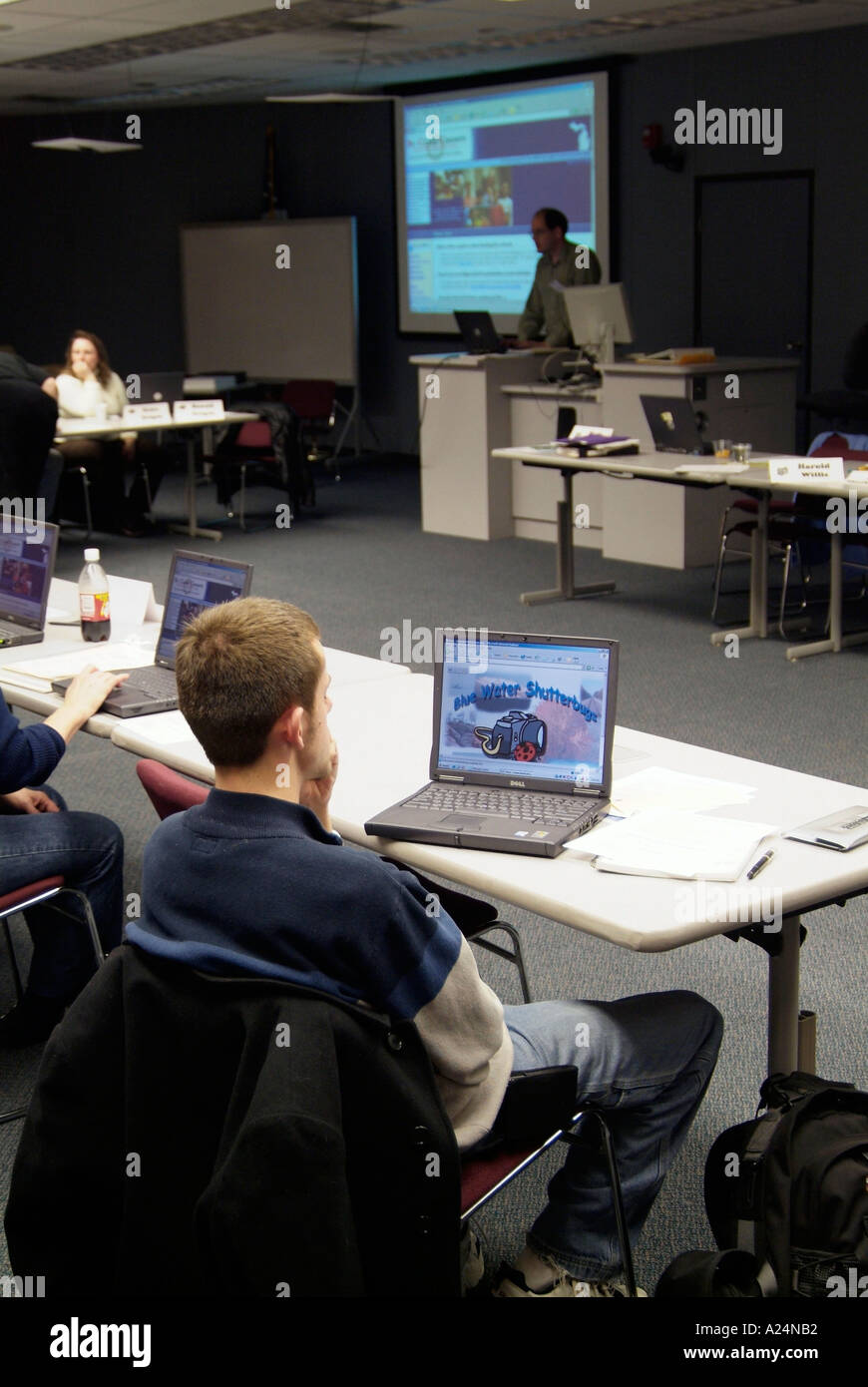 Adult computer class training is conducted during a business meeting ...