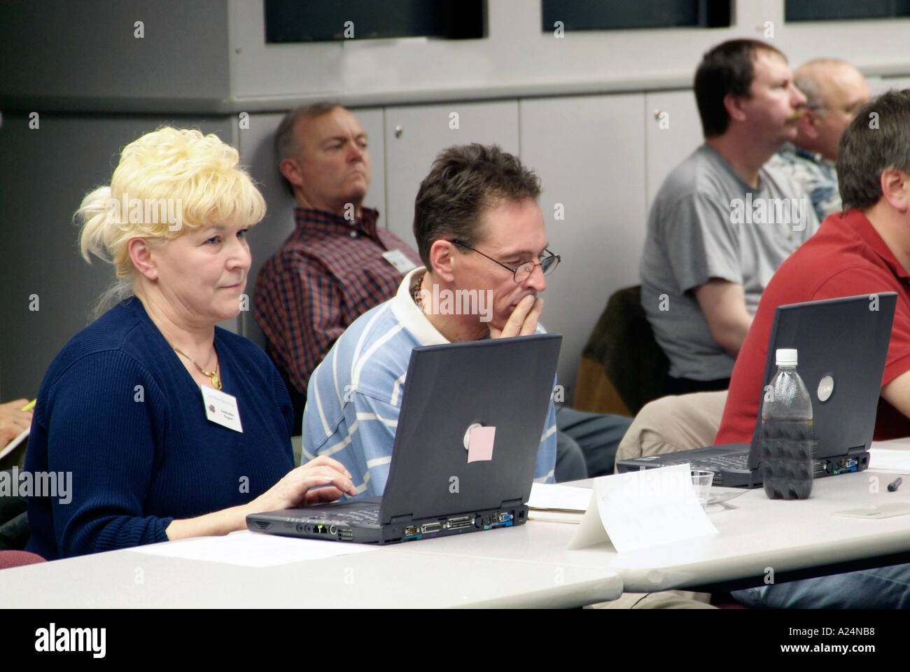 Adult computer class training is conducted during a business meeting ...