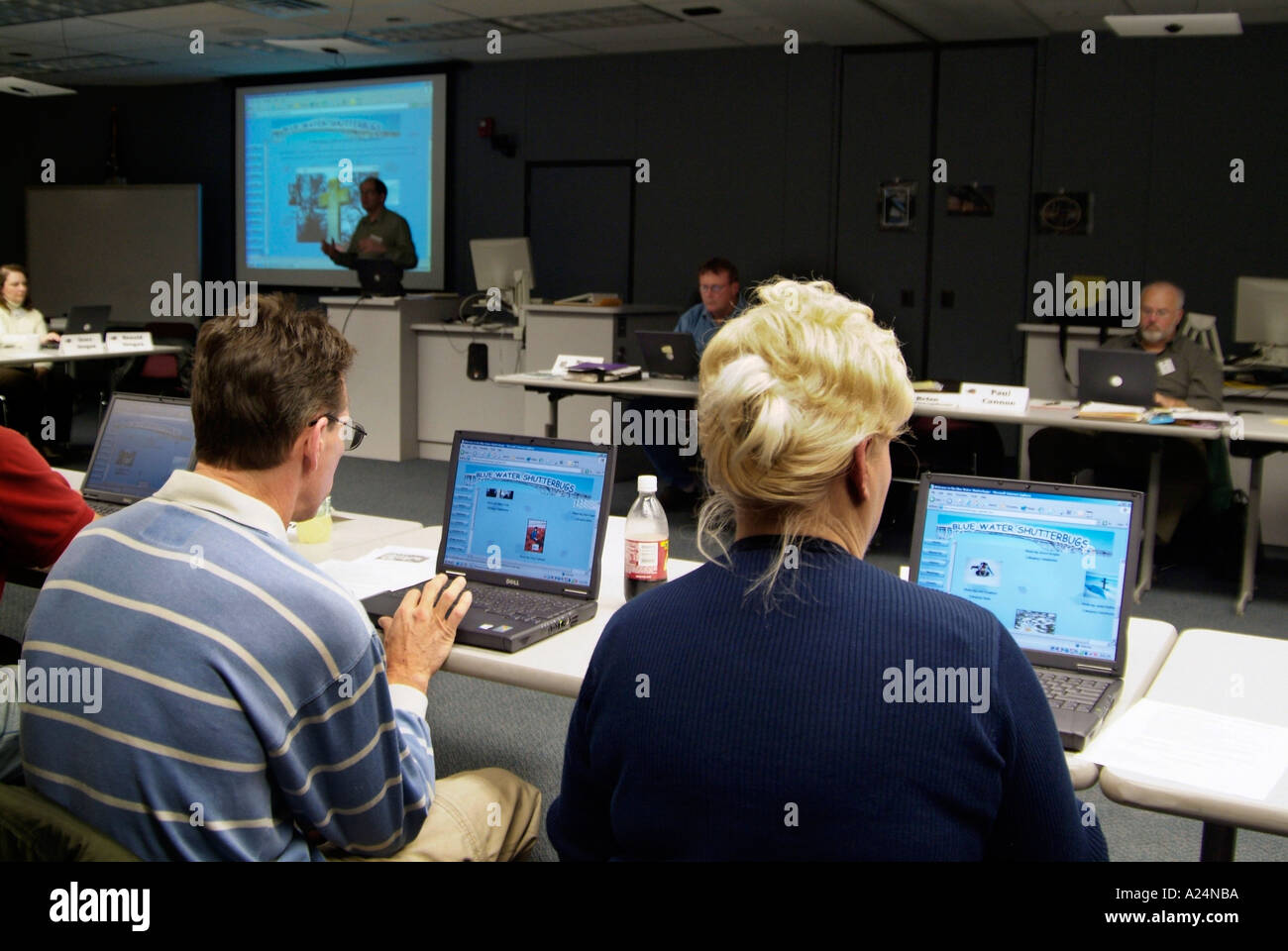 Adult computer class training is conducted during a business meeting ...