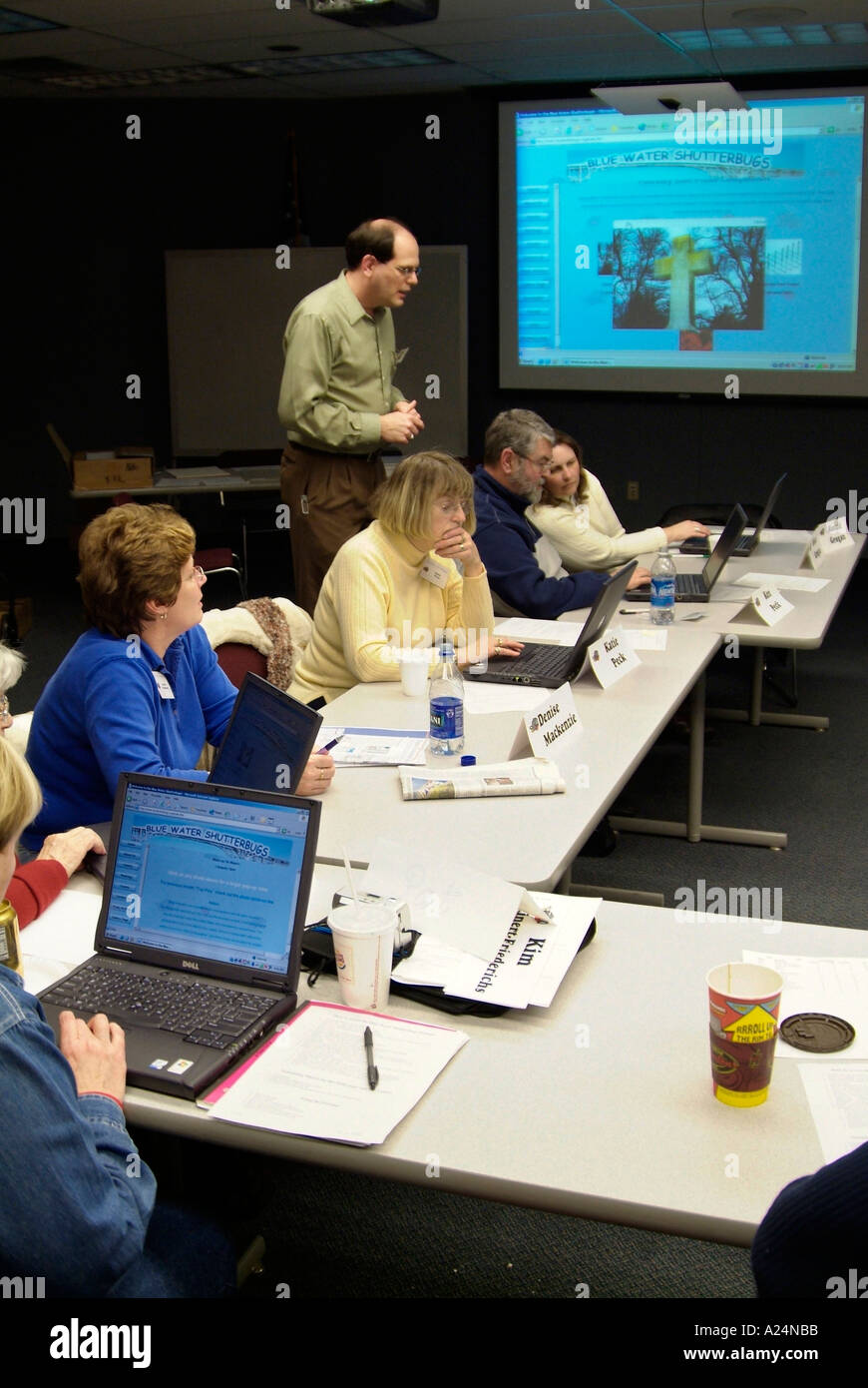 Adult computer class training is conducted during a business meeting ...