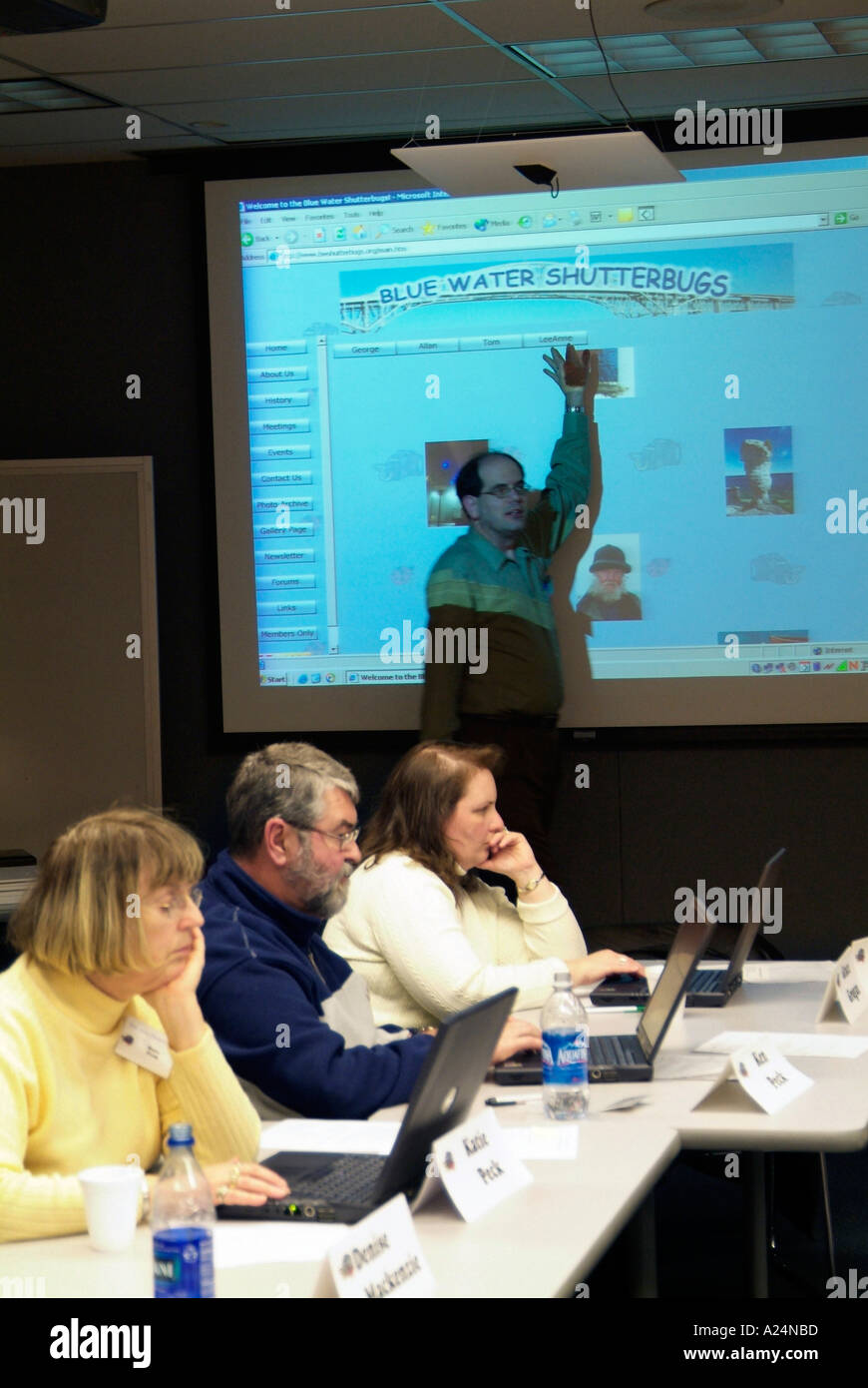 Adult computer class training is conducted during a business meeting ...