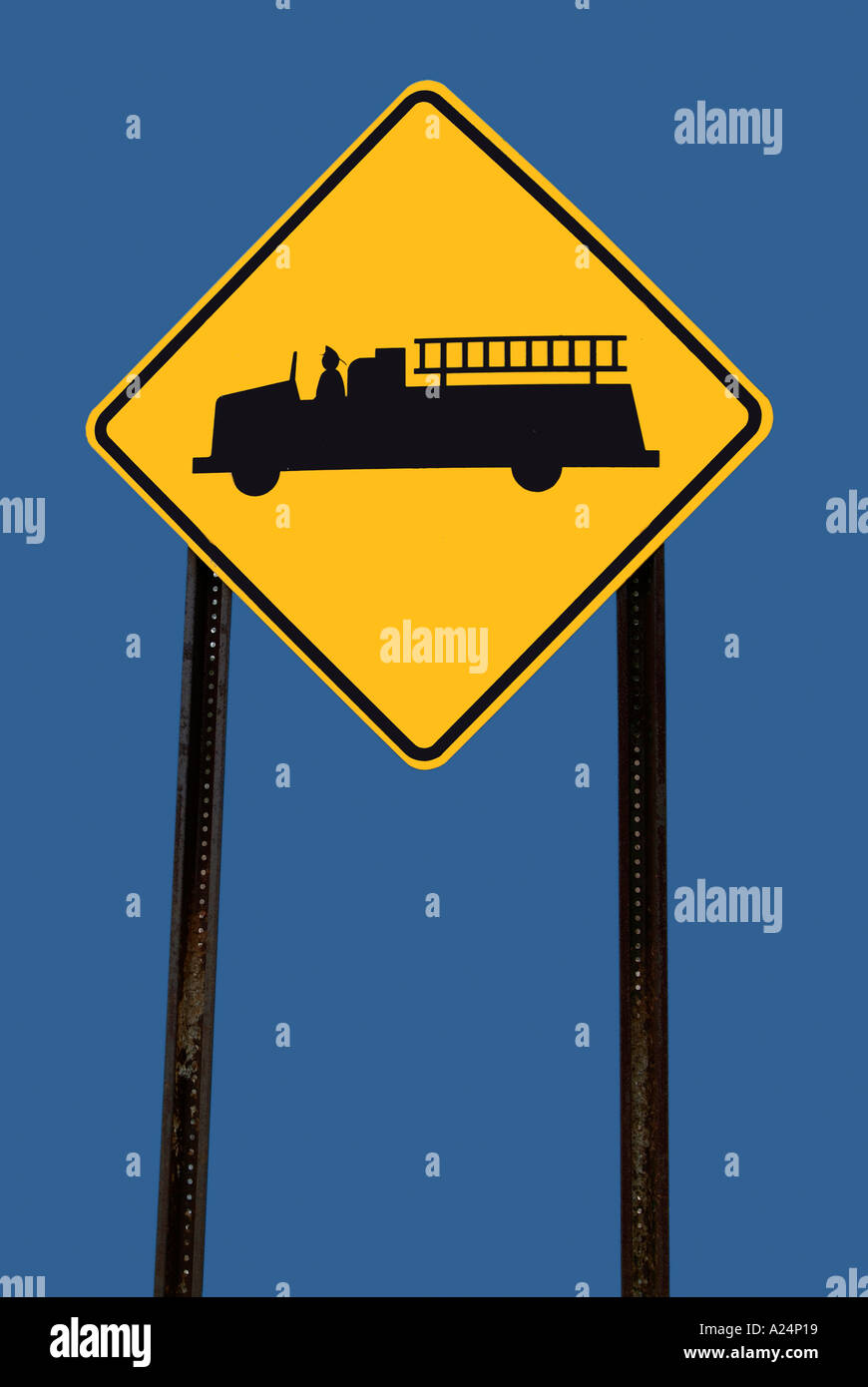 Street sign with fire truck warning indicating a fire station nearby ...