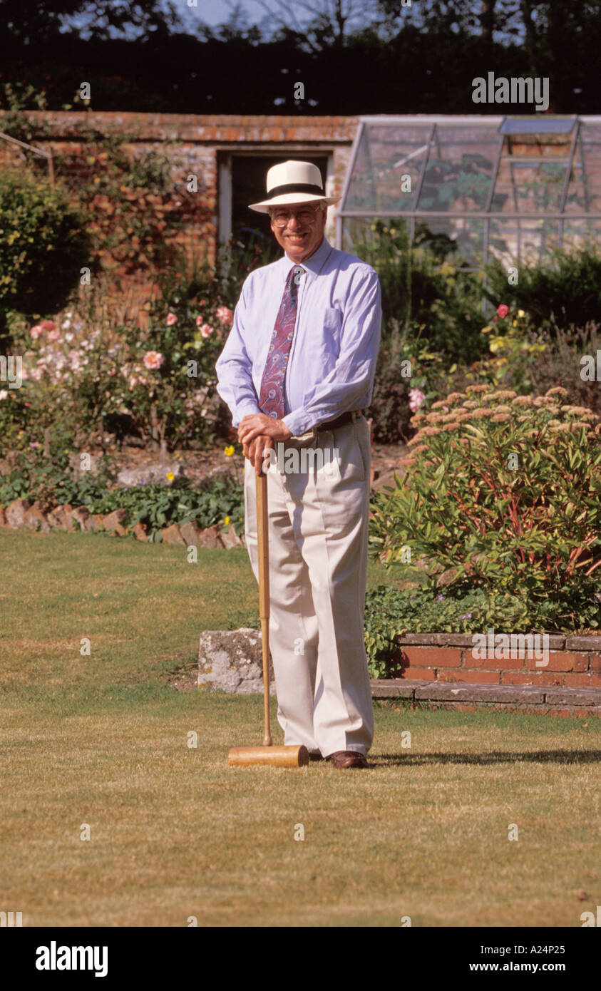 Croquet game players in Victorian Dress Lawn Grass Hoop Ball Mallet Man ...
