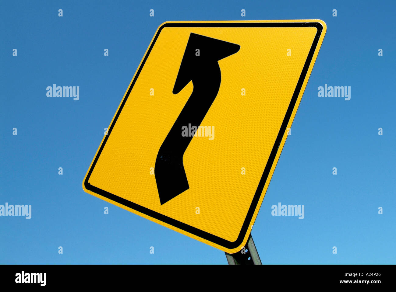 Curve in road street sign Stock Photo - Alamy