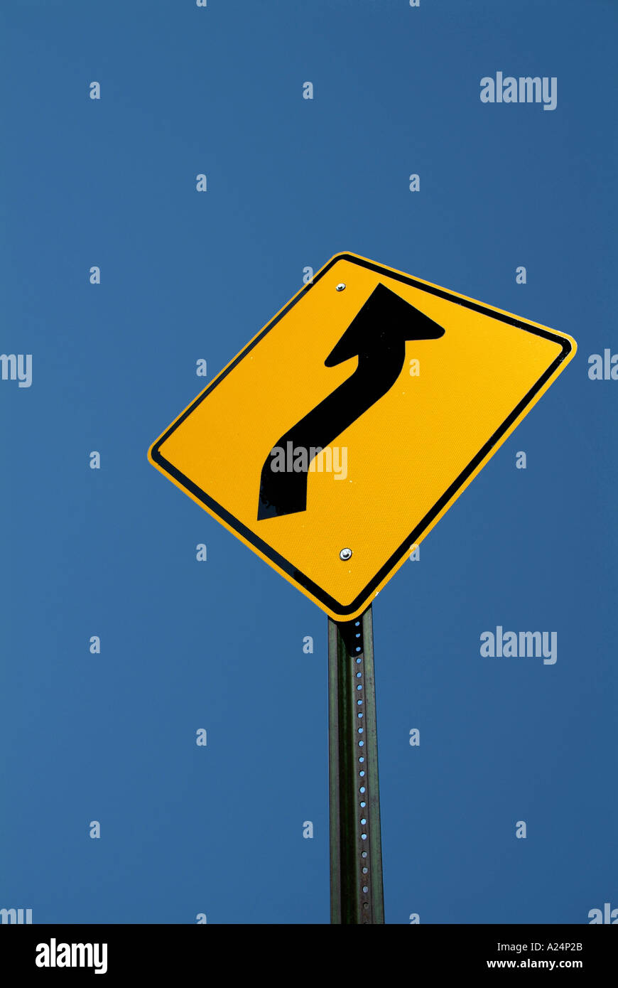 Curve in road street sign Stock Photo - Alamy