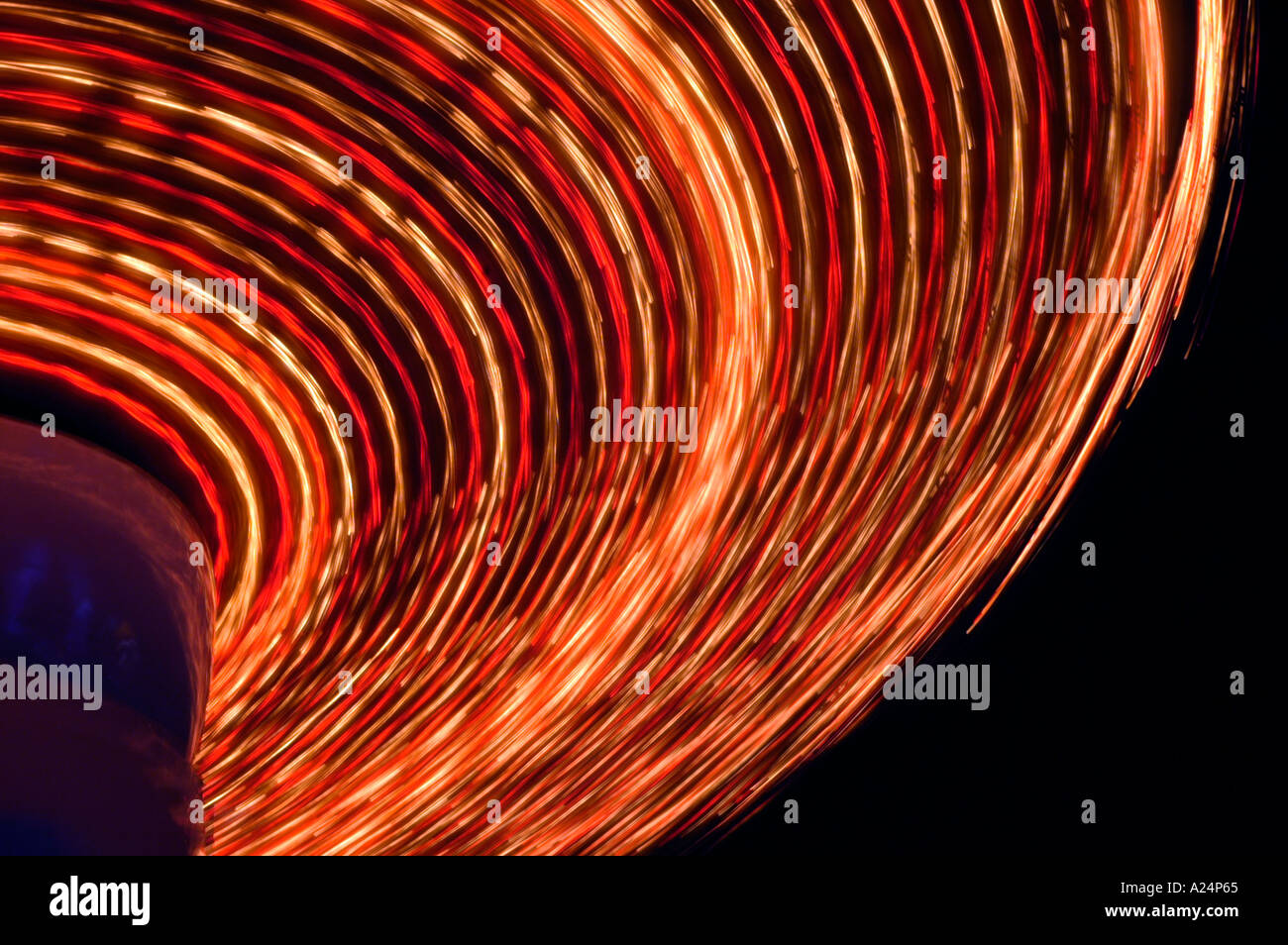Fair ground ride at night moving streaks of light Stock Photo - Alamy