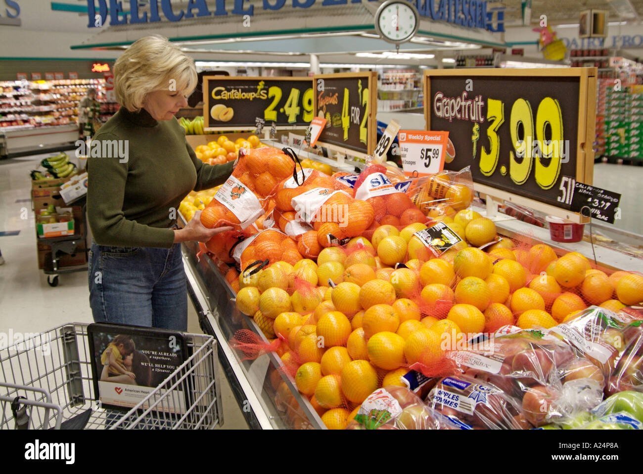 Consumer shops in a modern food super market for food Stock Photo - Alamy