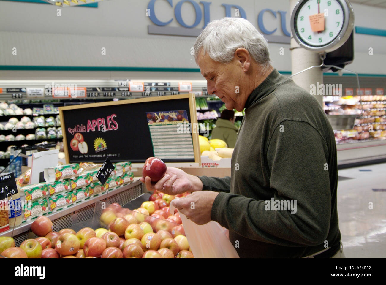 Consumer shops in a modern food super market for food Stock Photo - Alamy