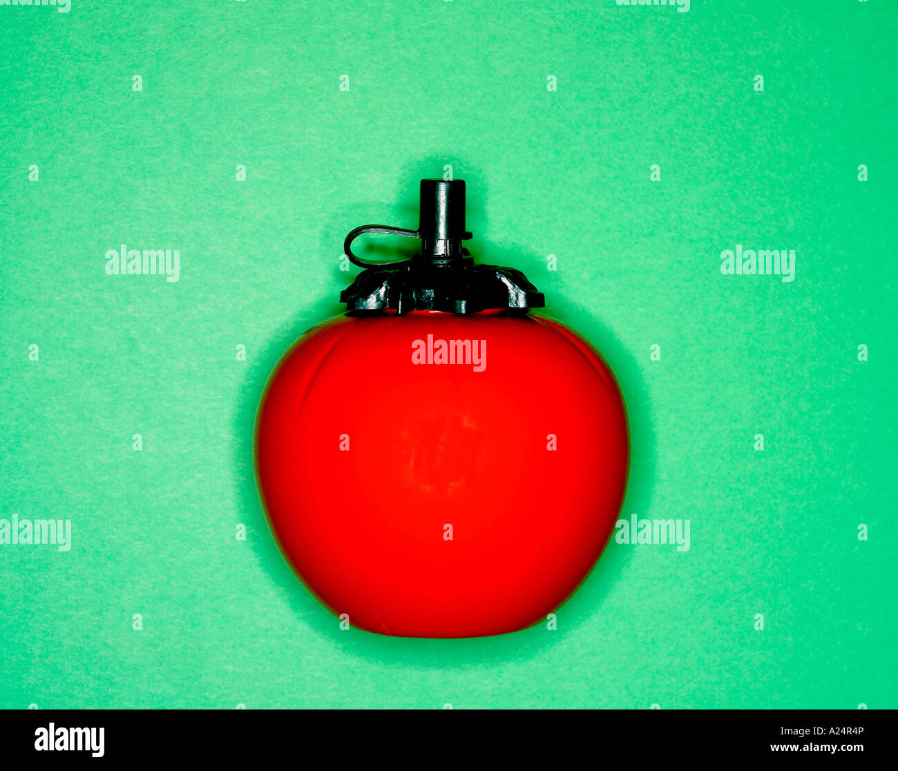 red ketchup tomato sauce bottle against green background shot with ...