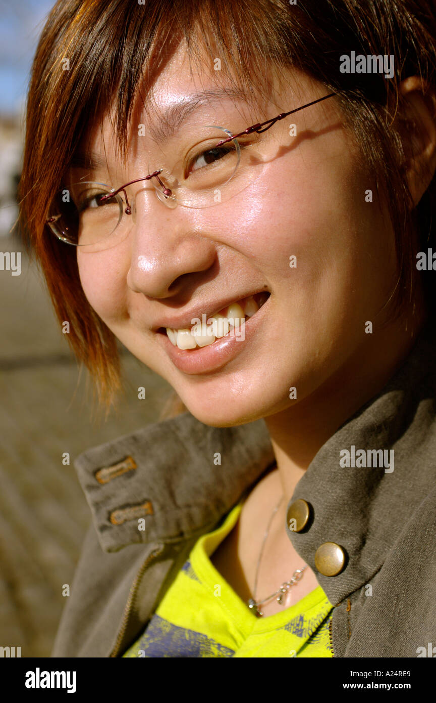 Portrait of attractive young Asian woman partial side view Stock Photo ...