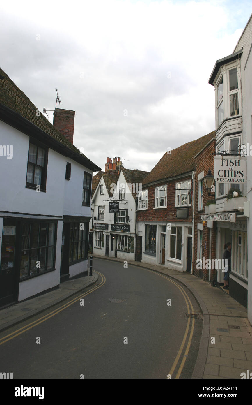 Road running through Rye in Kent with edwardian buildings either side ...