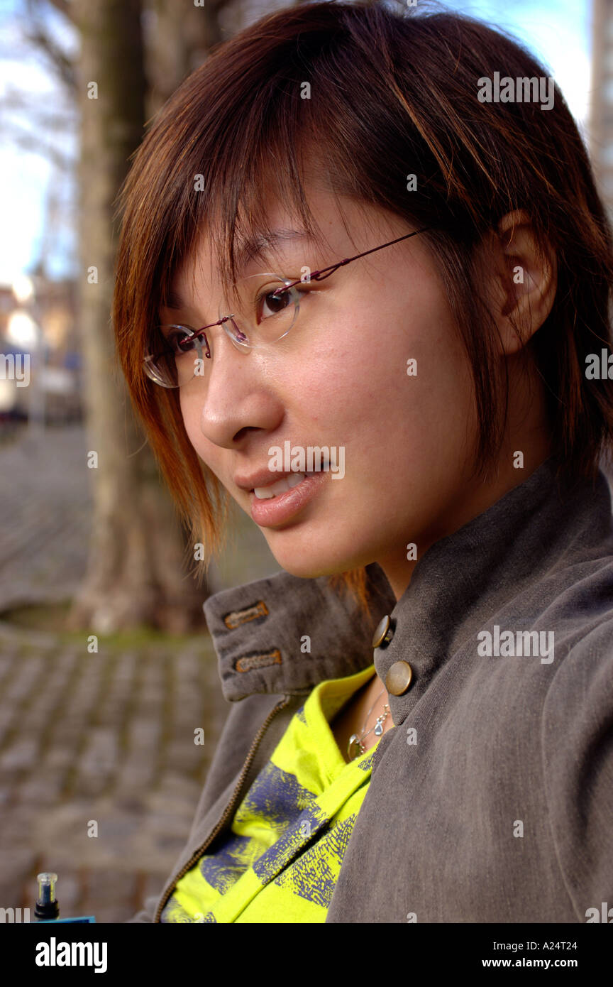 Portrait of attractive young Asian woman slight side view Stock Photo ...