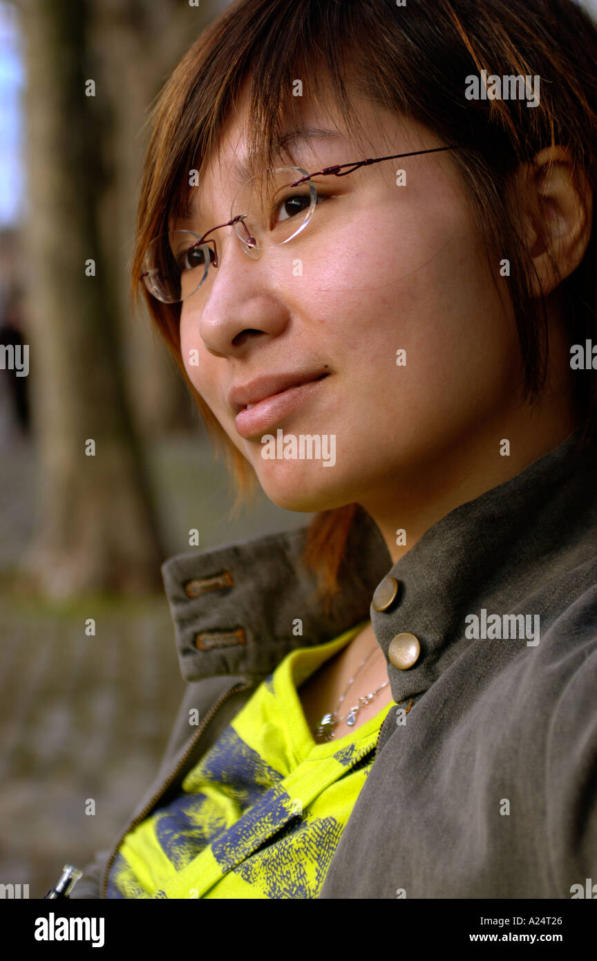 Portrait of attractive young Asian woman slight side view Stock Photo ...