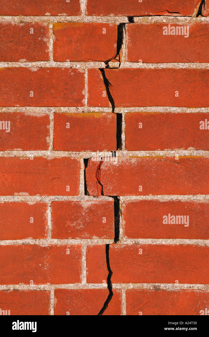 damage crack in structure of garden red brick wall Stock Photo - Alamy