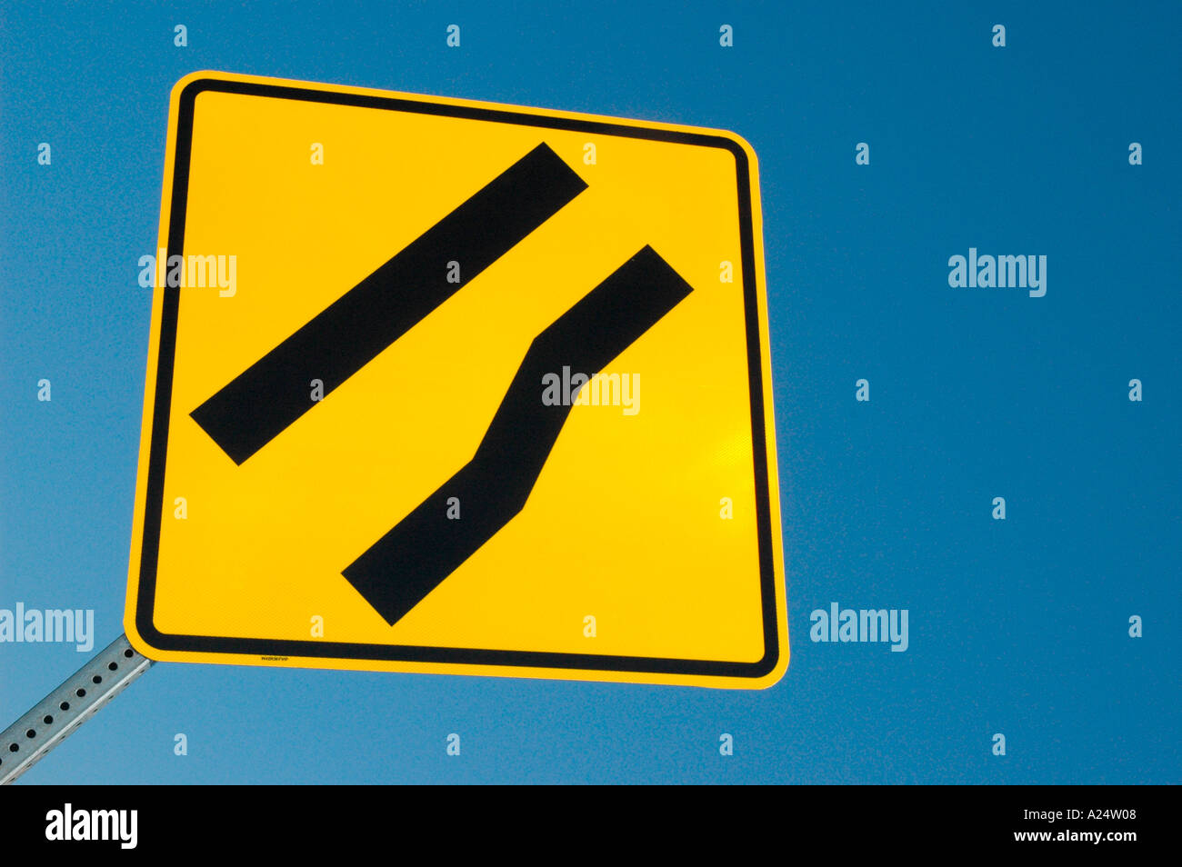 Freeway sign showing merge left as lane ends Stock Photo - Alamy