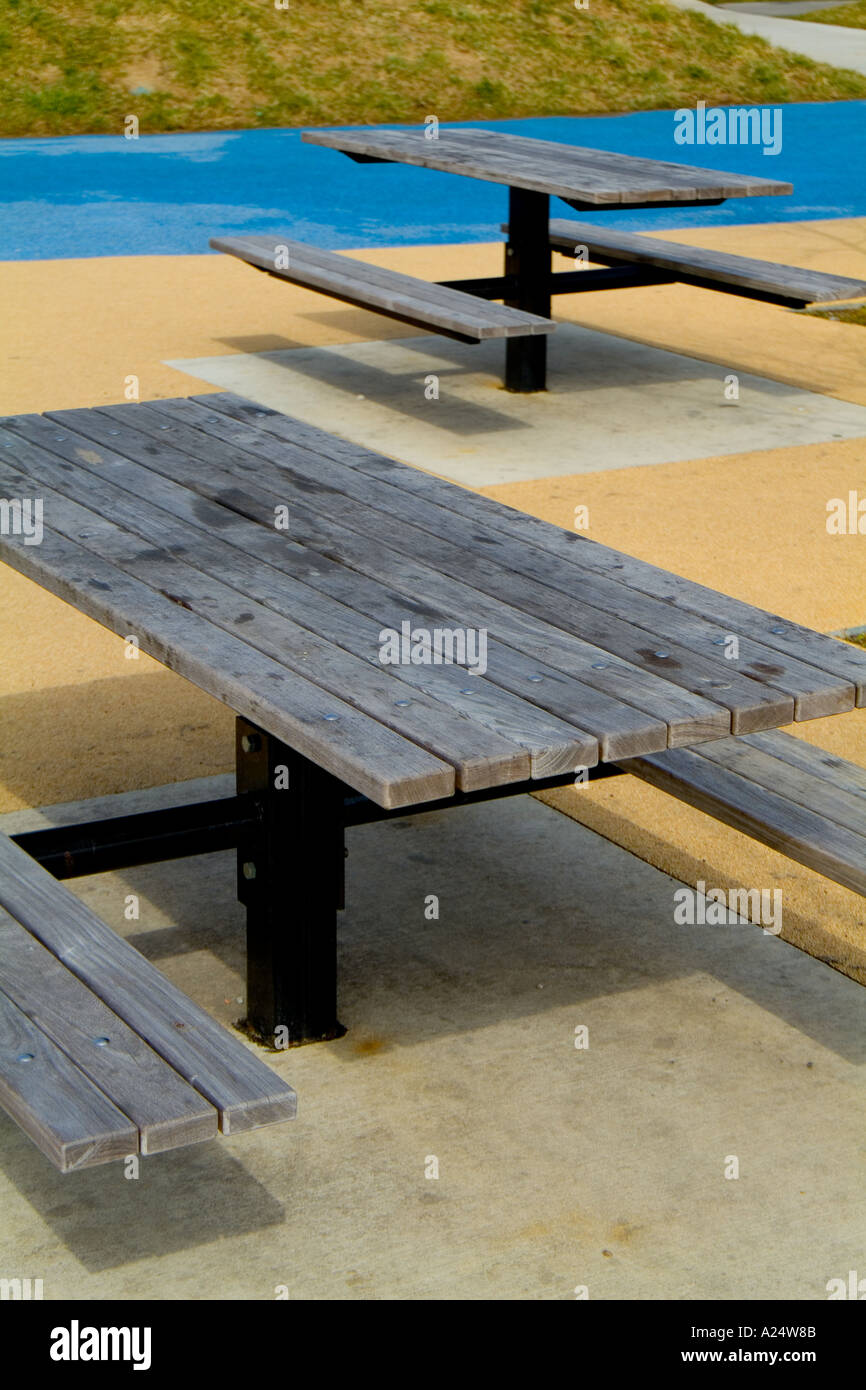 Picnic tables in playground Stock Photo - Alamy