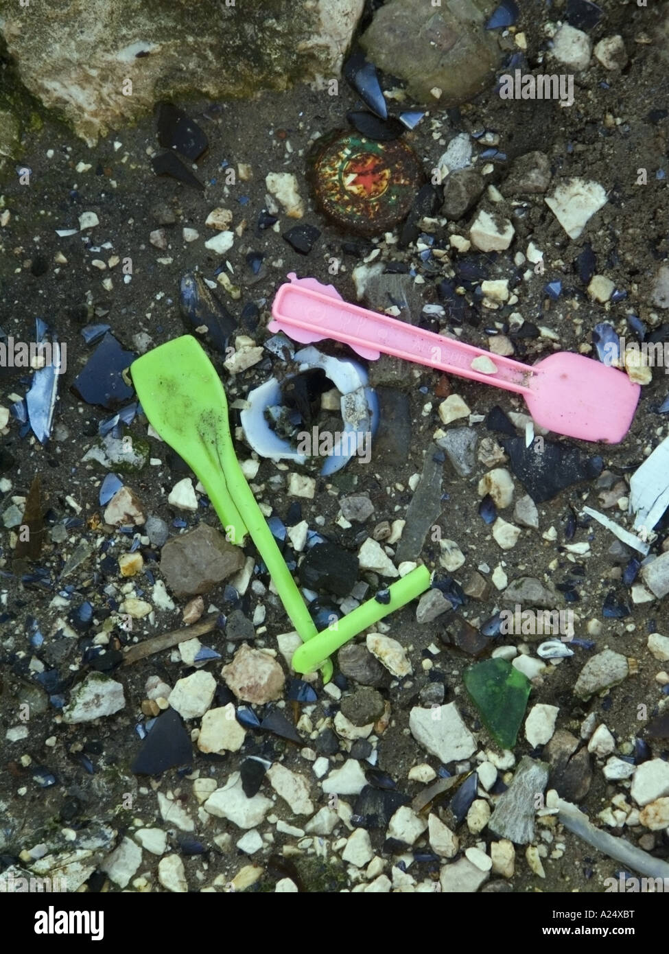 plastic spoon on the sand of Villaggio coppola, pollution of Naples ...