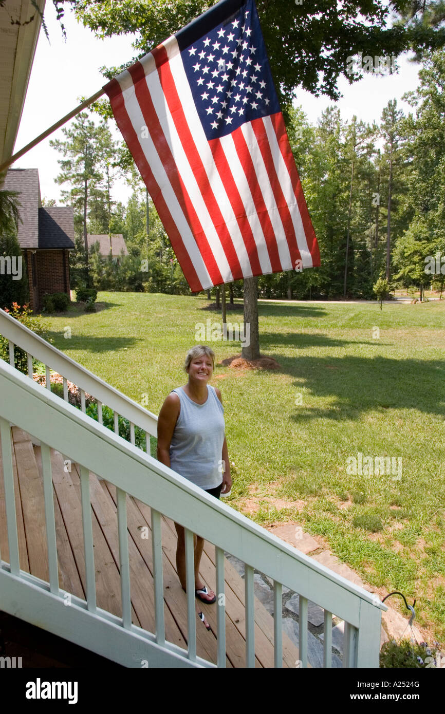 Woman on steps with flag Stock Photo - Alamy