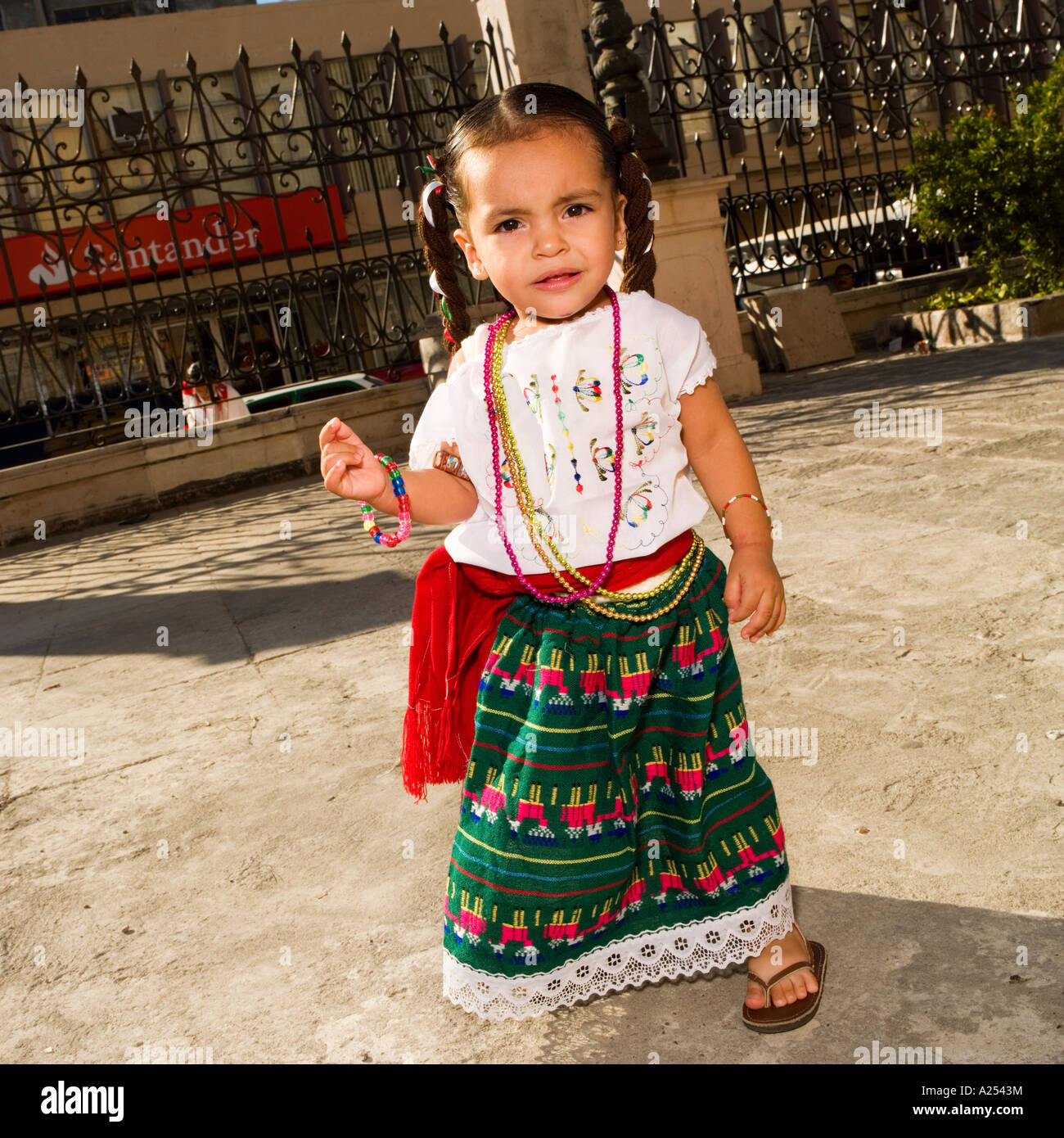 Girl dressed as a peasant on The Day of The Virgin in Mazatlan Sinaloa ...