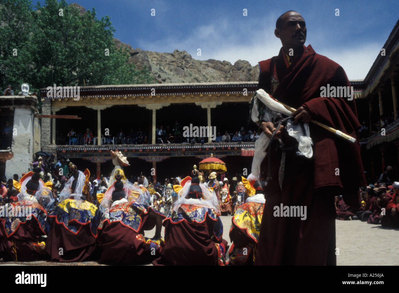 Bhuddist monk overseeing a ritual performance at the Hemis monastery in ...