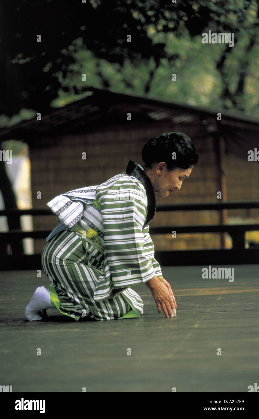 JAPANESE WOMAN KNEELING DOWN TO PRAY Stock Photo - Alamy