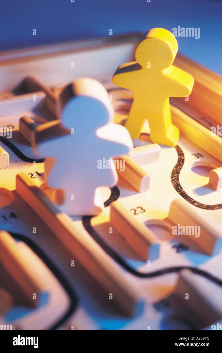 Wooden Figures on Maze Stock Photo - Alamy