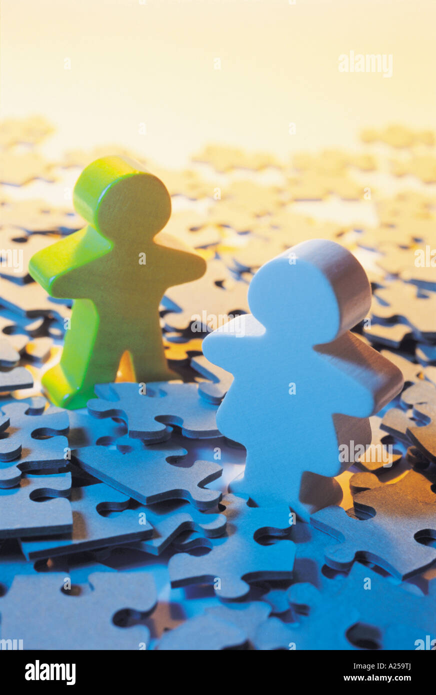 Figures on puzzle pieces hi-res stock photography and images - Alamy