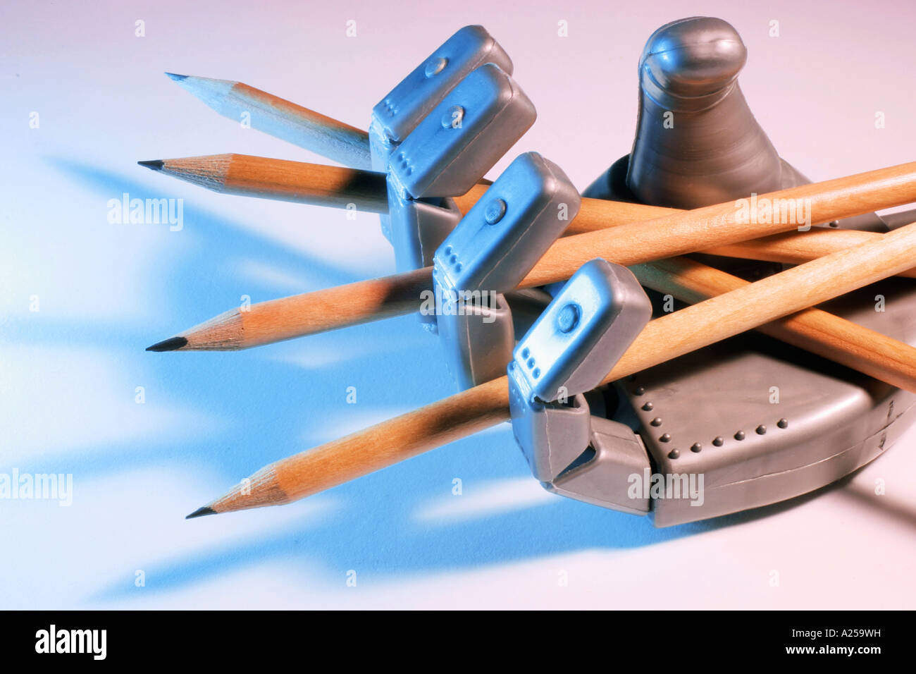 Robotic Hand with Pencils Stock Photo - Alamy