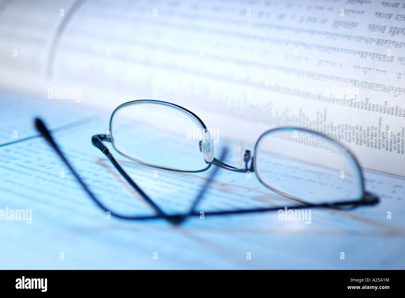 Eyeglasses on Stock Listings Stock Photo - Alamy