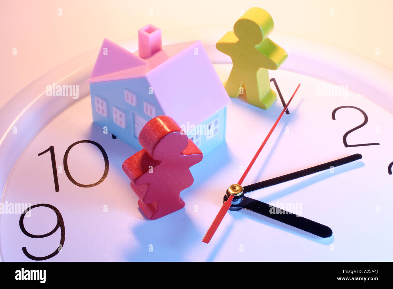 Children Figures and Toy House on Clock Stock Photo - Alamy