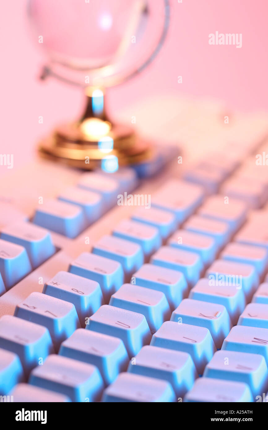 Crystal Globe on Computer Keyboard Stock Photo - Alamy