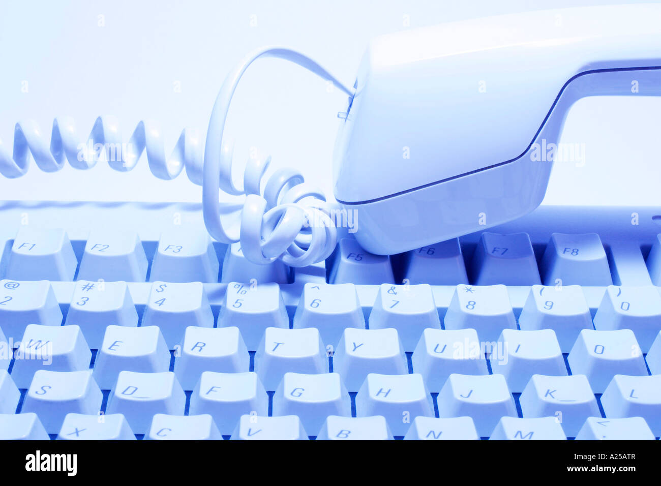 Computer Keyboard and Telephone Receiver Stock Photo - Alamy