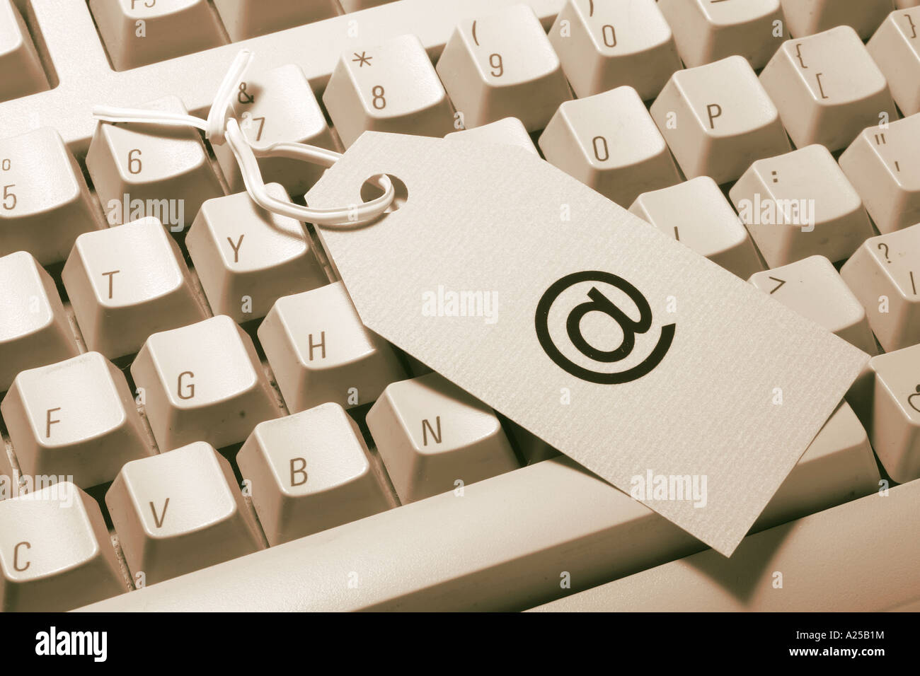 Computer Keyboard with At Sign Tag Stock Photo - Alamy
