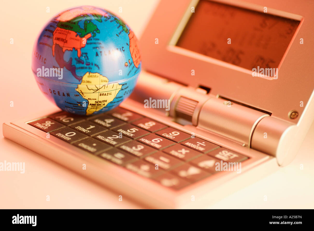 Globe and Digital Clock Stock Photo - Alamy