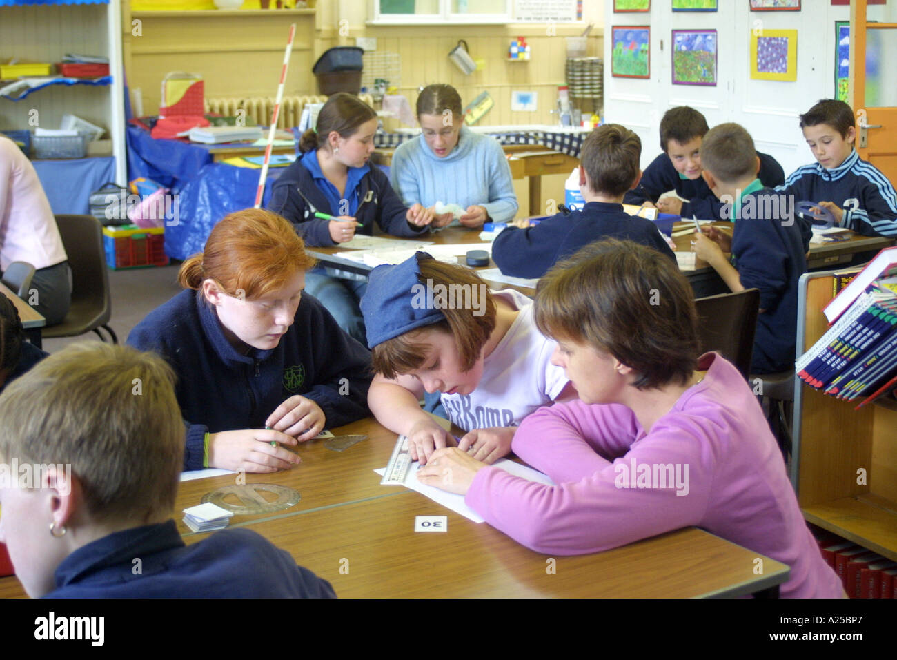 Nine to ten year old, fifth year students working in a math lesson with ...