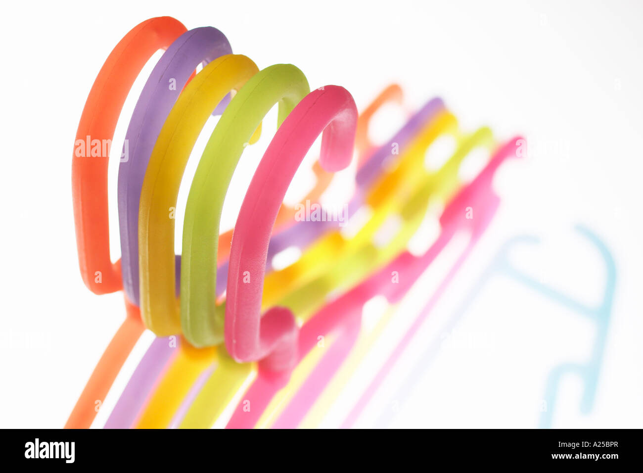 Multi colored plastic clothes hangers hi-res stock photography and ...