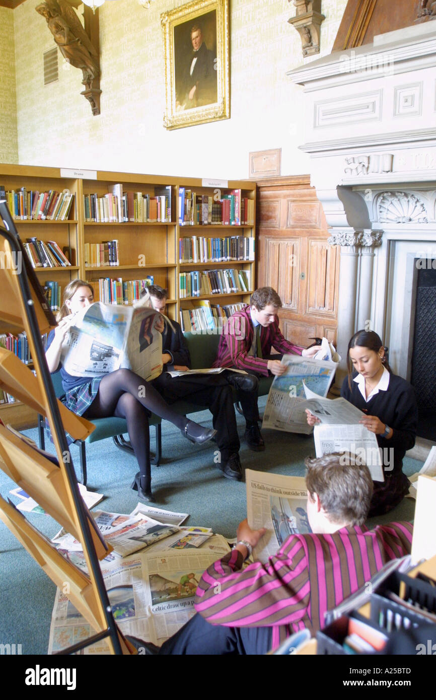 A level students reading the national papers in the library Stock Photo ...