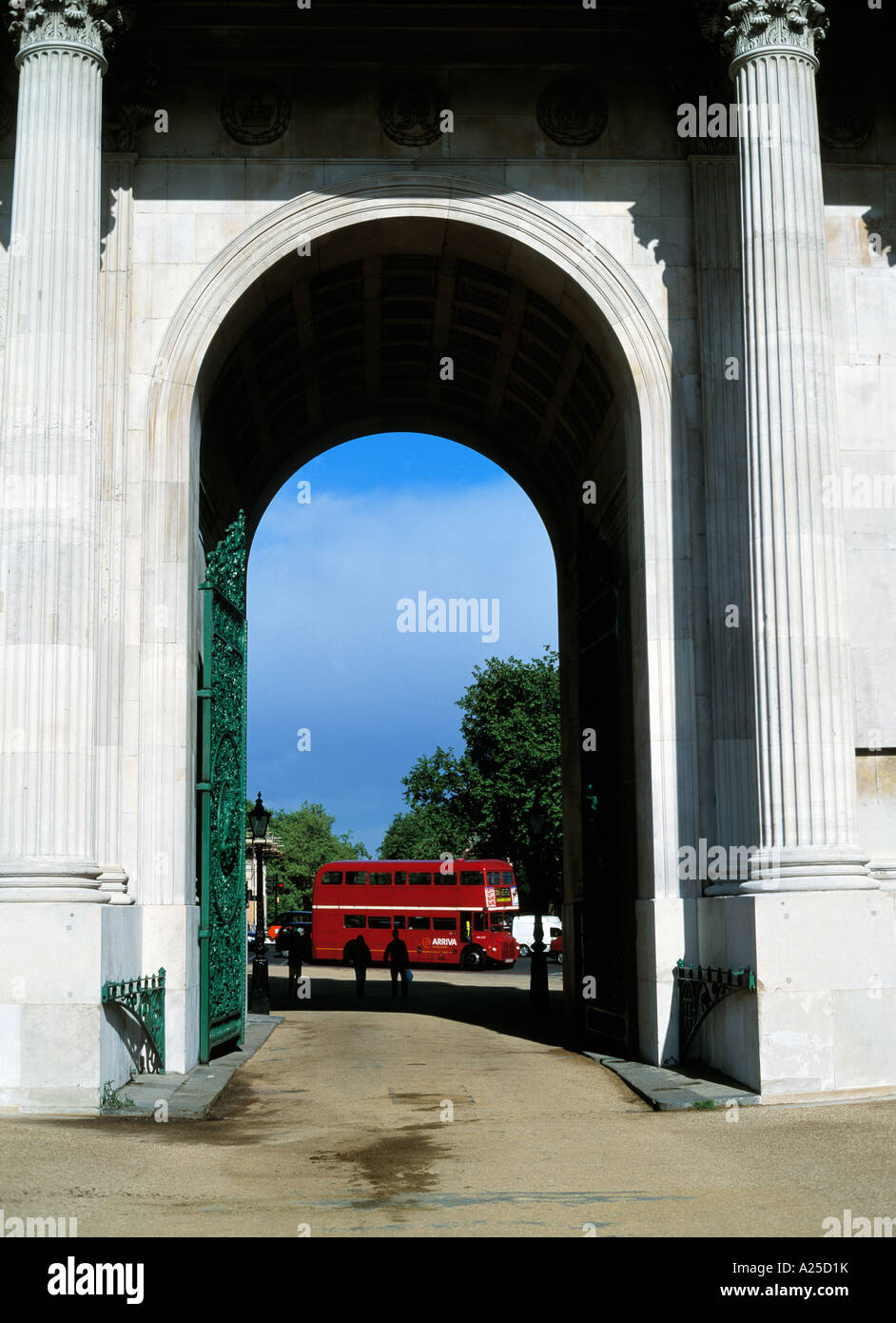 london city red bus through archway Stock Photo - Alamy