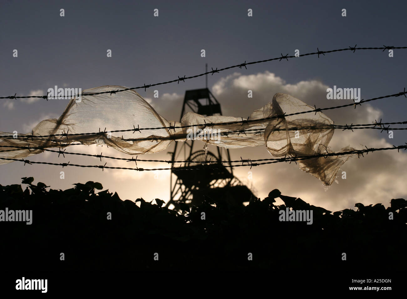 View of South Crofty Tin Mine Wheel head through barbed wire Pool ...