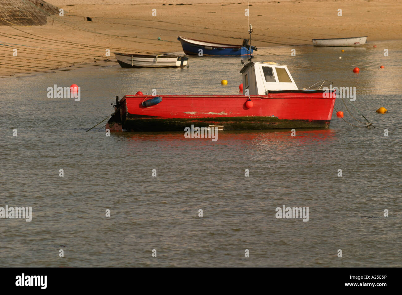 Small red boat in St. Ives harbour Cornwall UK Stock Photo - Alamy