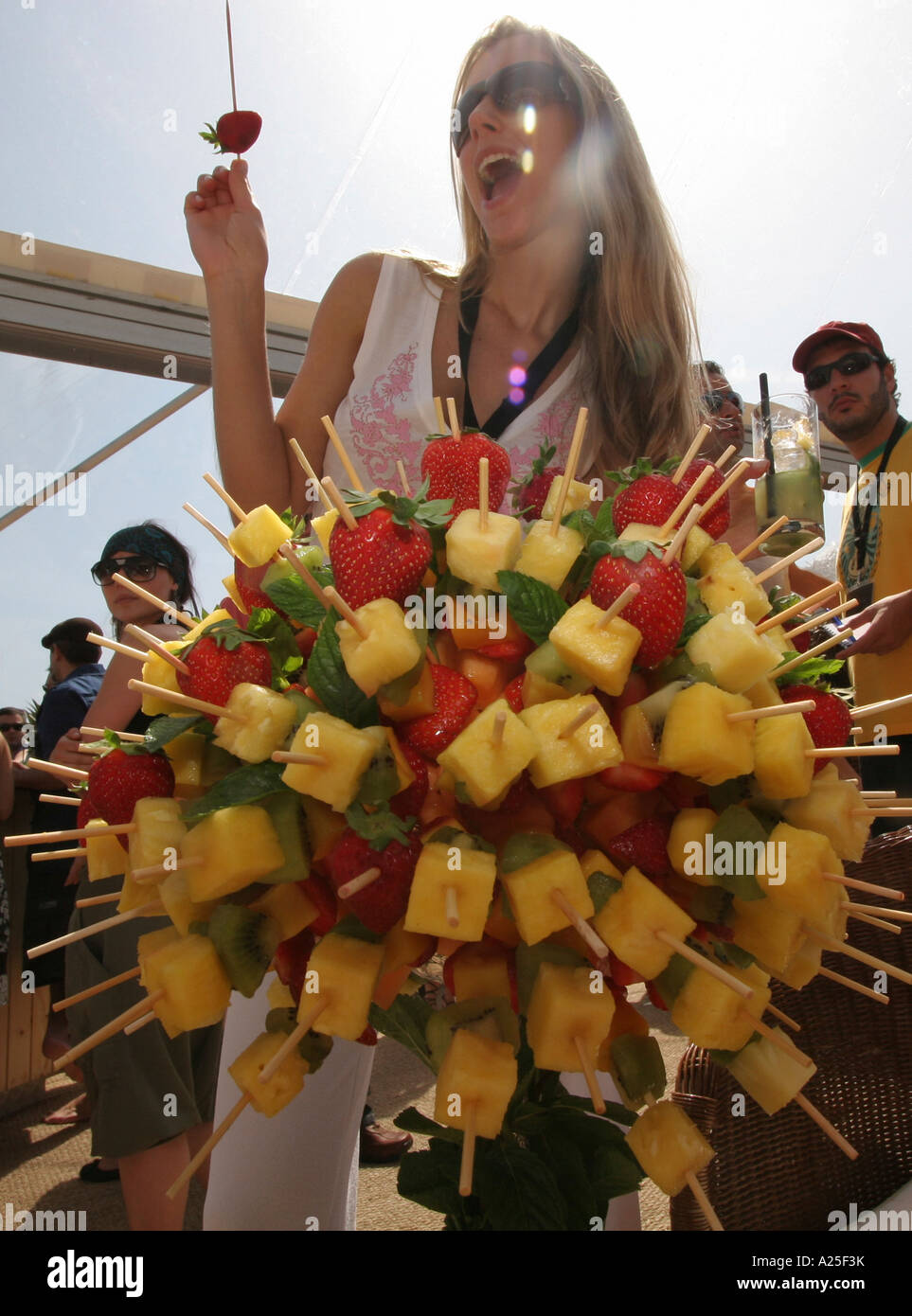 woman eating canapes, Cannes, France Stock Photo - Alamy