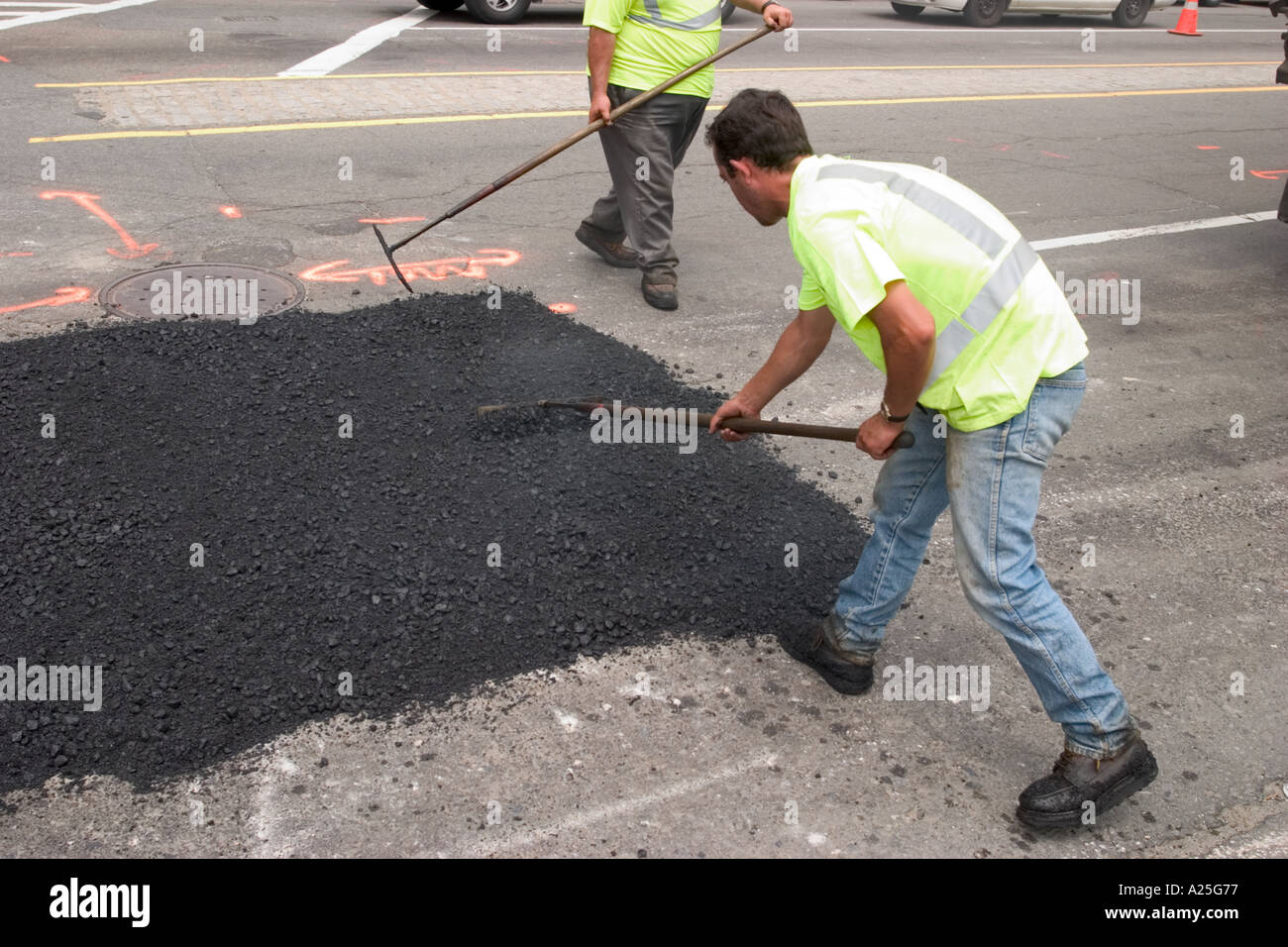Men fixing a road hi-res stock photography and images - Alamy