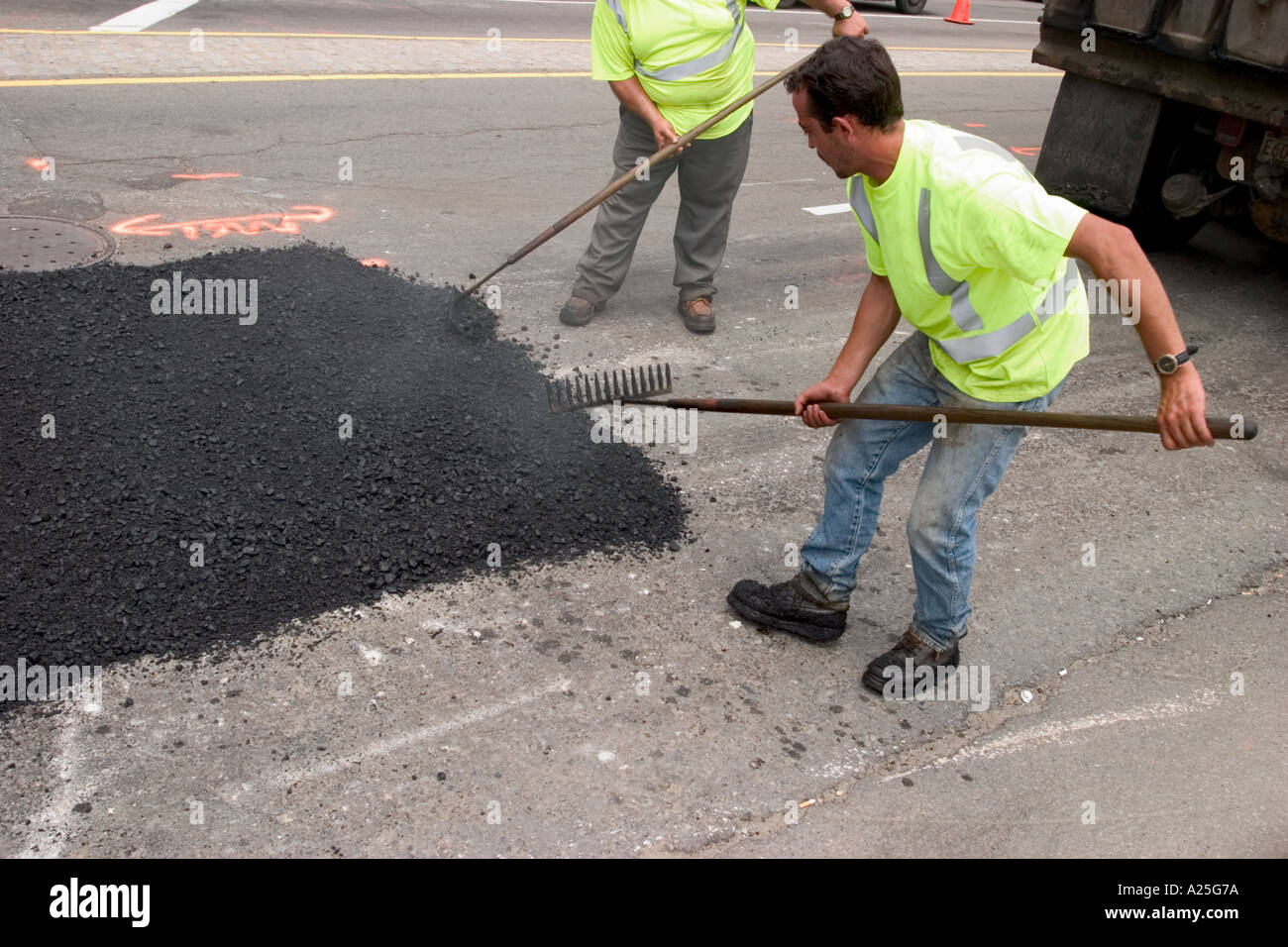 Men fixing a road hi-res stock photography and images - Alamy