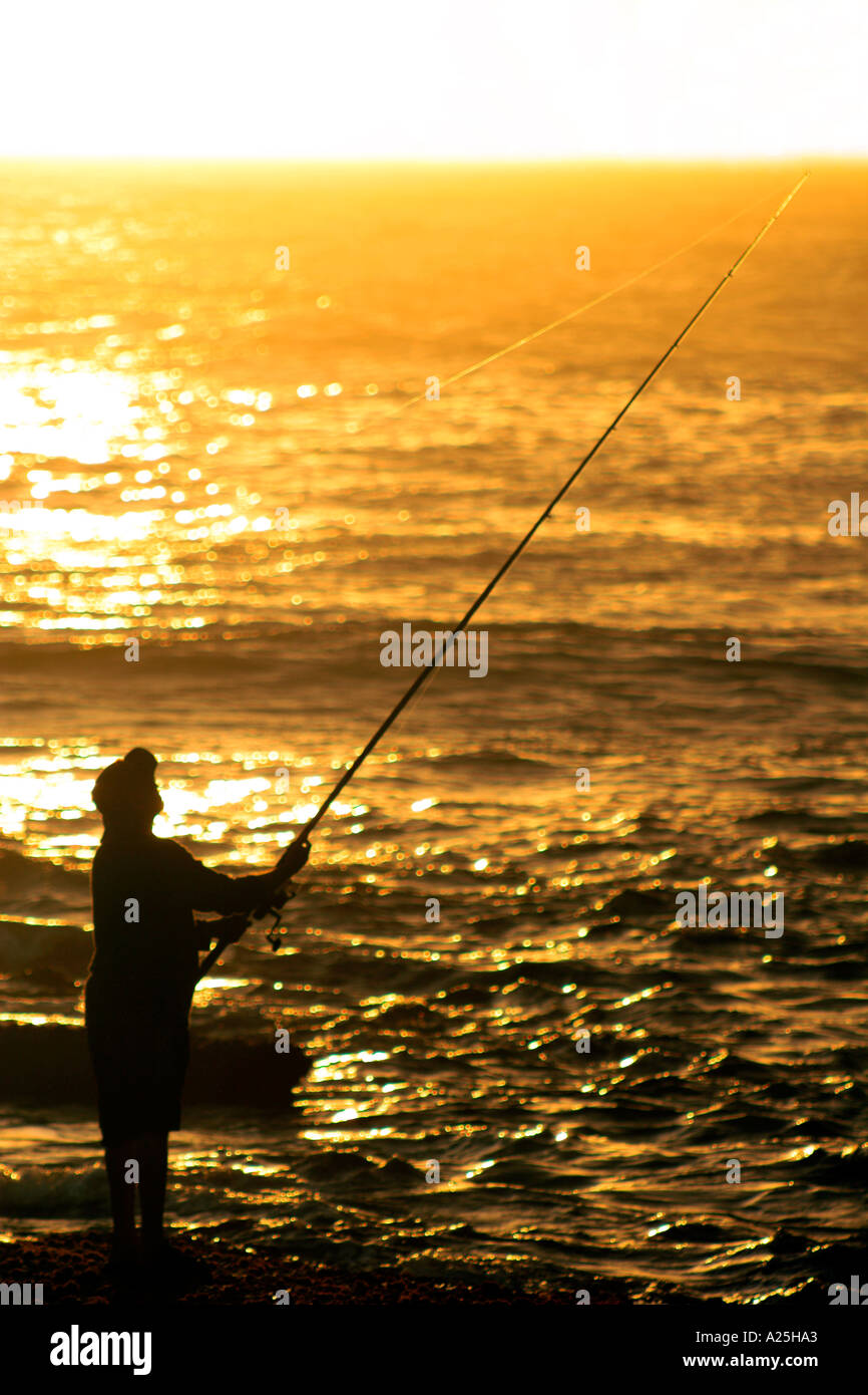 Man ocean sea fishing silhouette sunset South Africa Stock Photo - Alamy