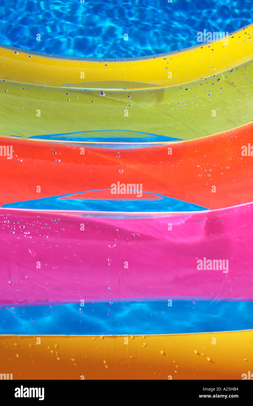 Colourful colorful lilo in swimming pool Stock Photo - Alamy